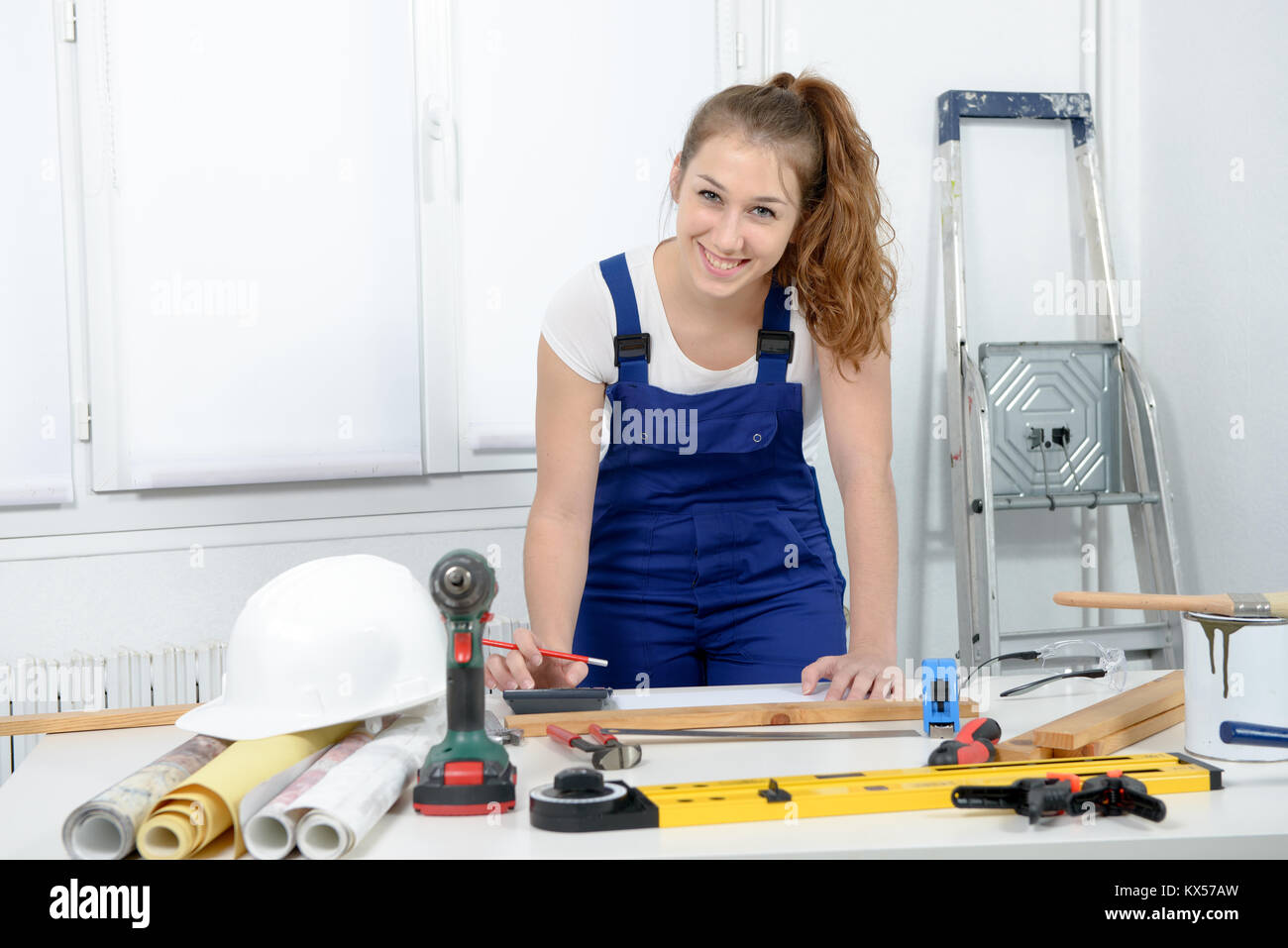 pretty young woman doing DIY work at home Stock Photo - Alamy