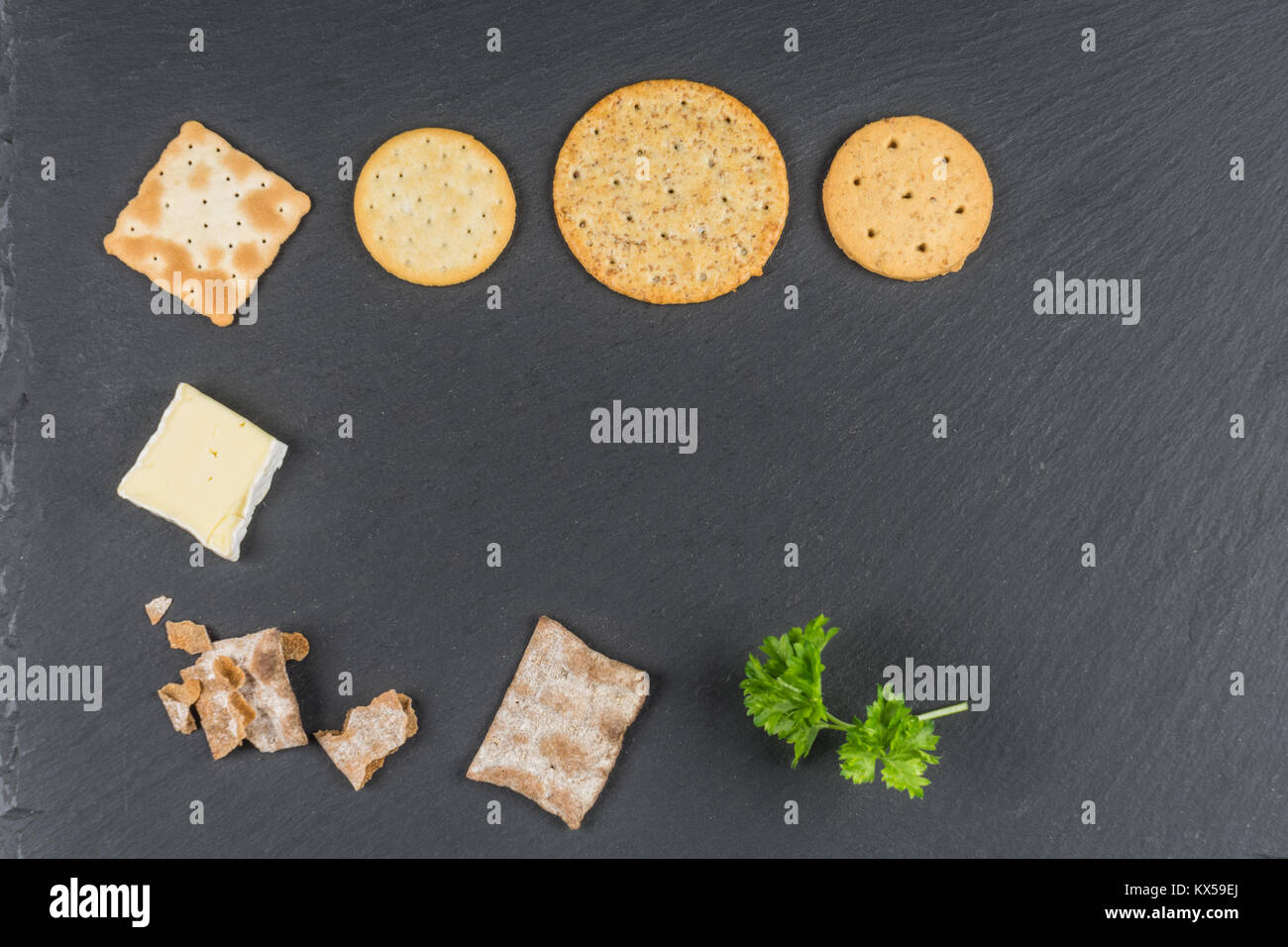Dry cracker cookies with black background Stock Photo - Alamy