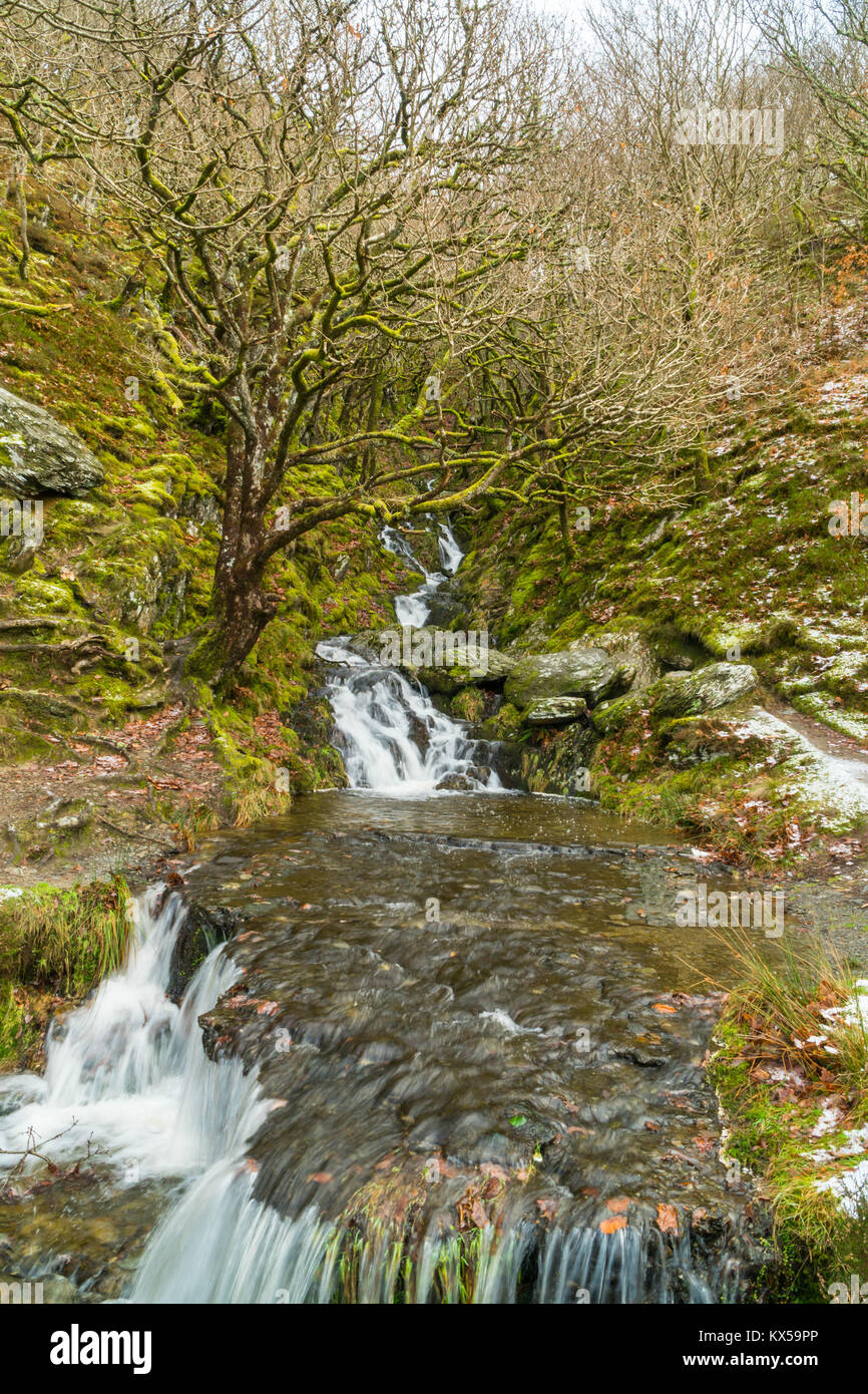 Stream flowing down through the Welsh mountains eventually joining the ...