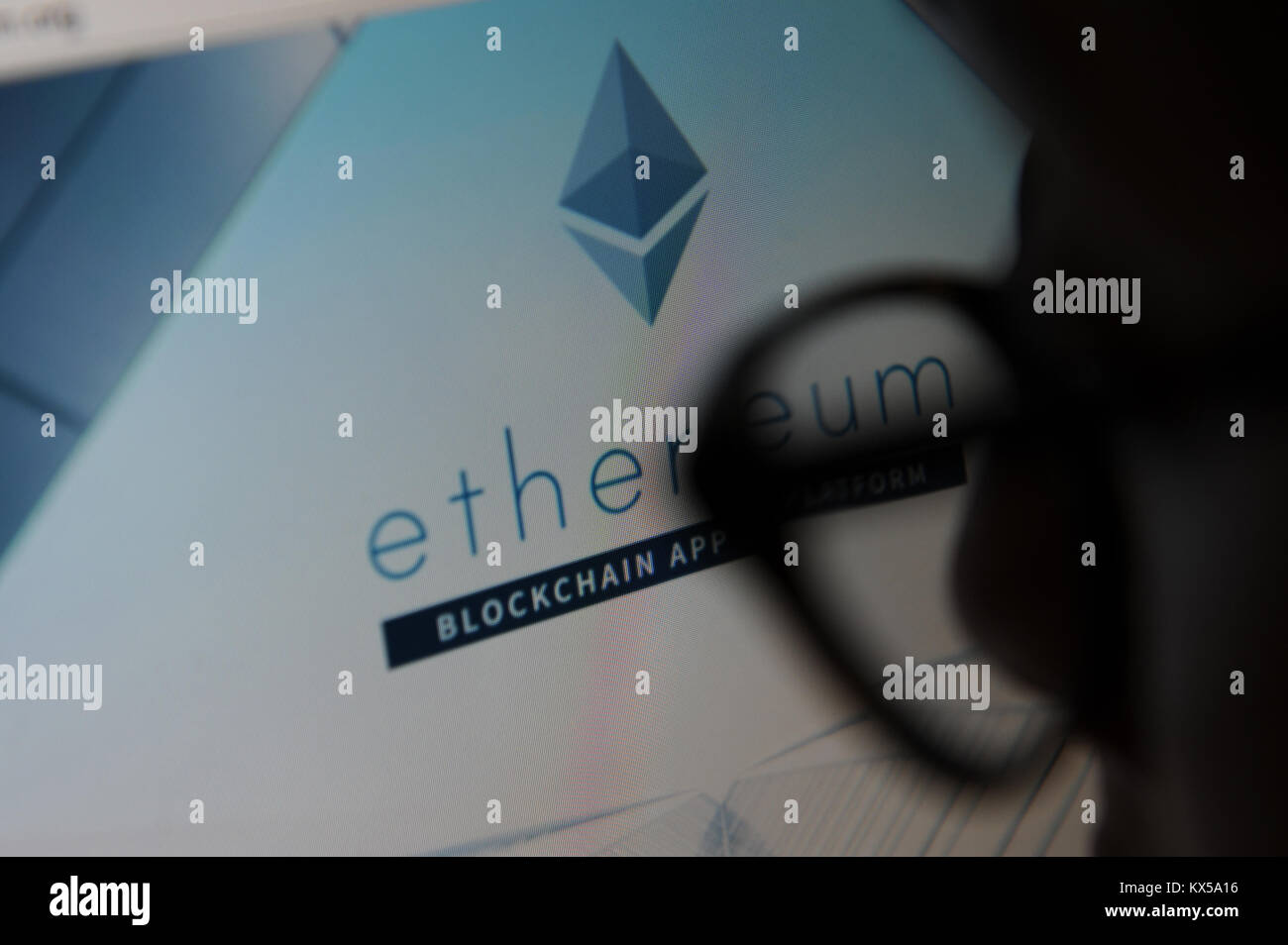A woman looks at Ethereum website. Ethereum is a cryptocurrency Stock ...