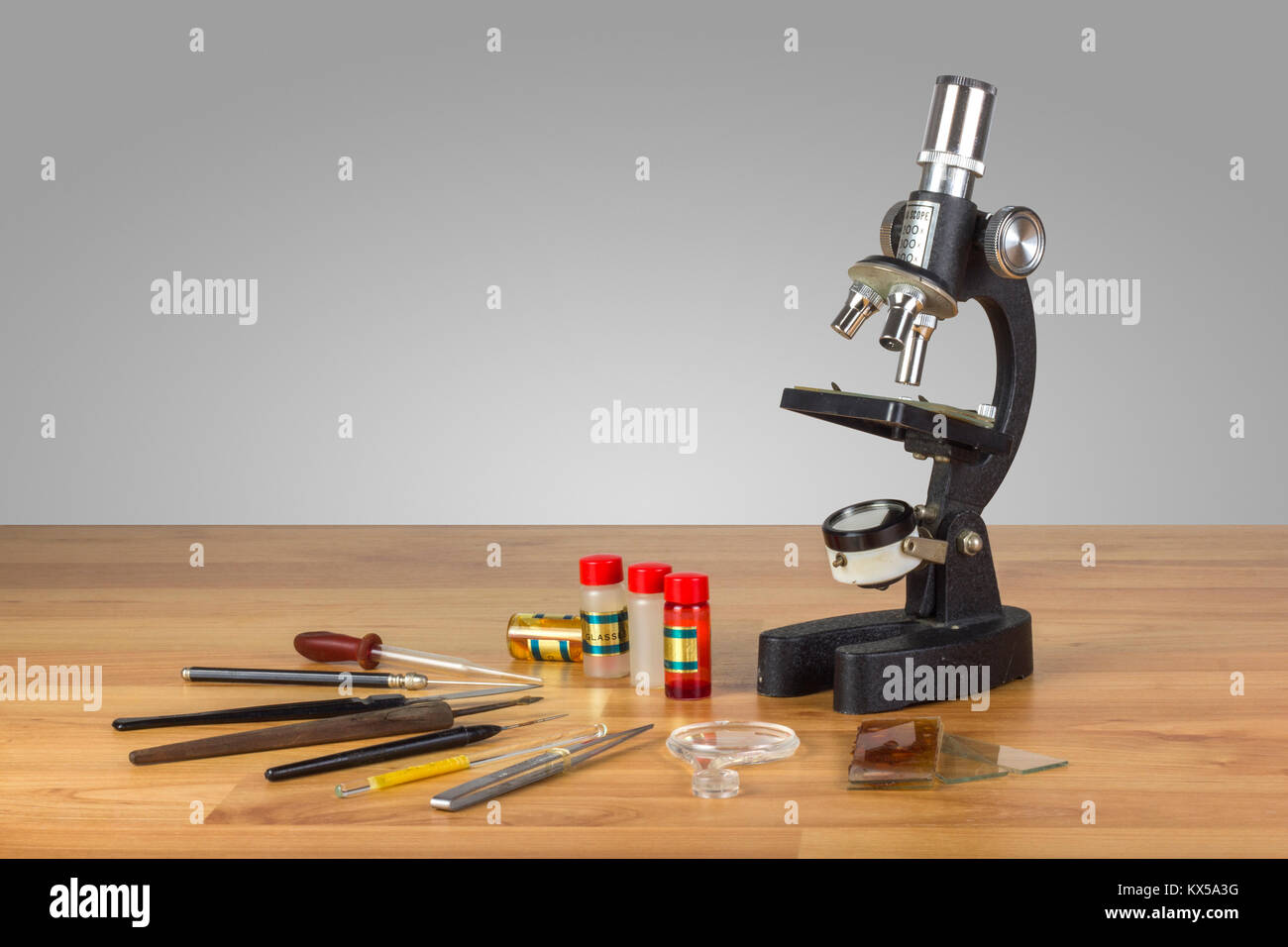 old microscope kit isolated on white background Stock Photo - Alamy