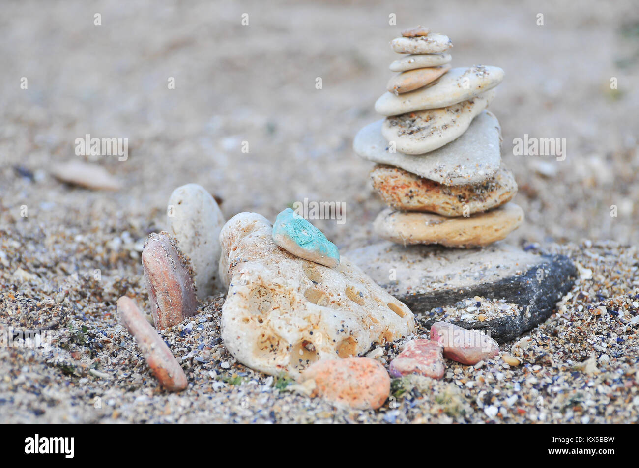 Pyramid stones balance on the sand of the beach Stock Photo - Alamy