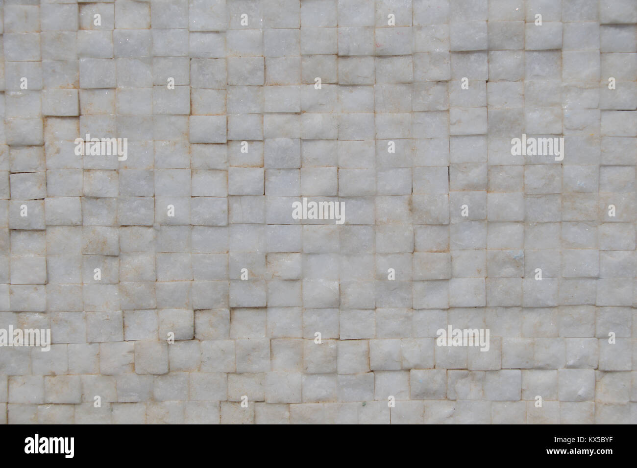 Decorative cubic stone wall as background texture Stock Photo - Alamy
