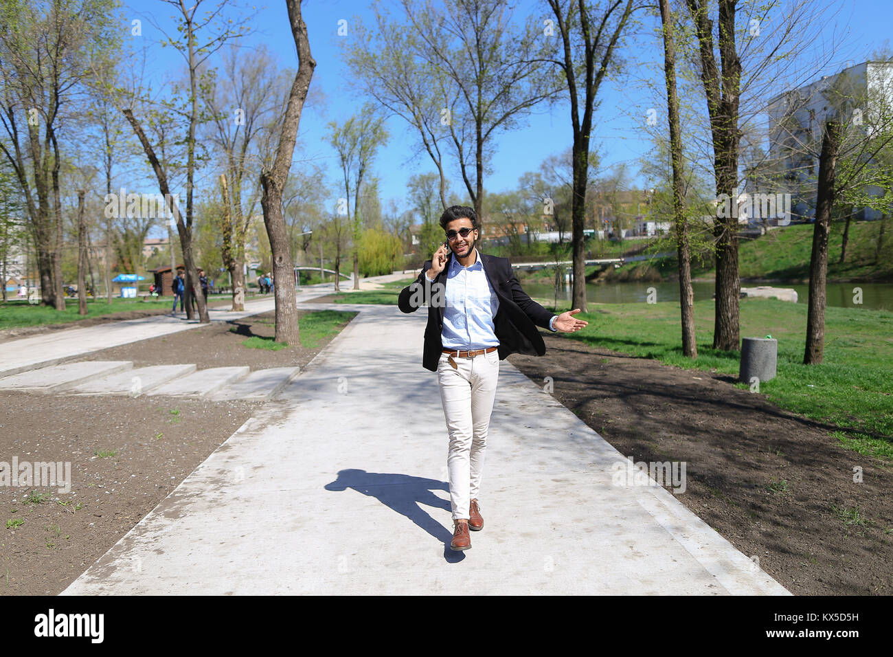 Young man walking outdoor slow hi-res stock photography and images - Alamy