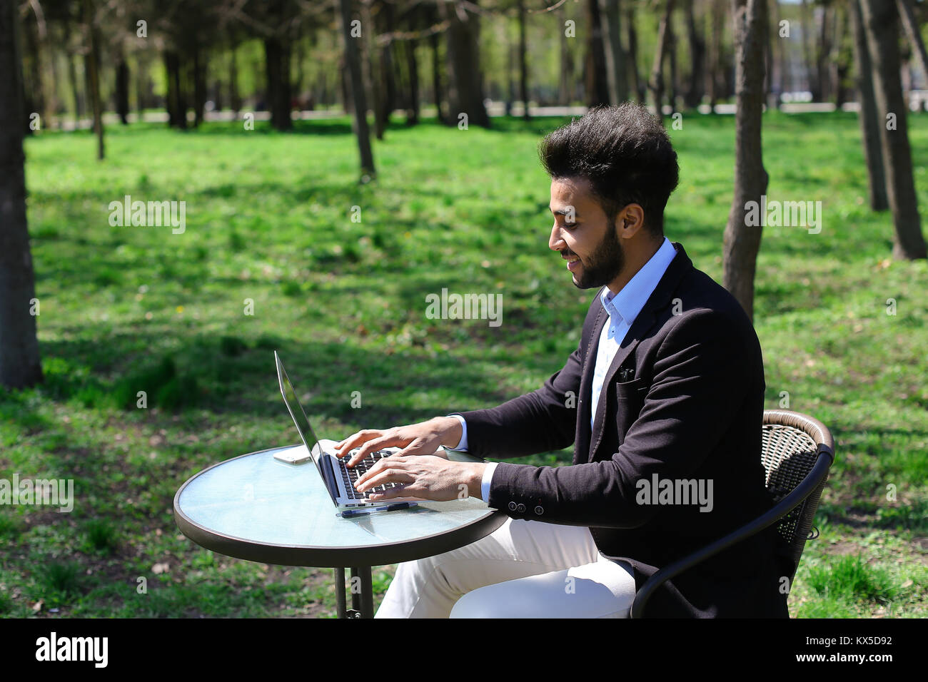 Journalist finished work in park Stock Photo - Alamy