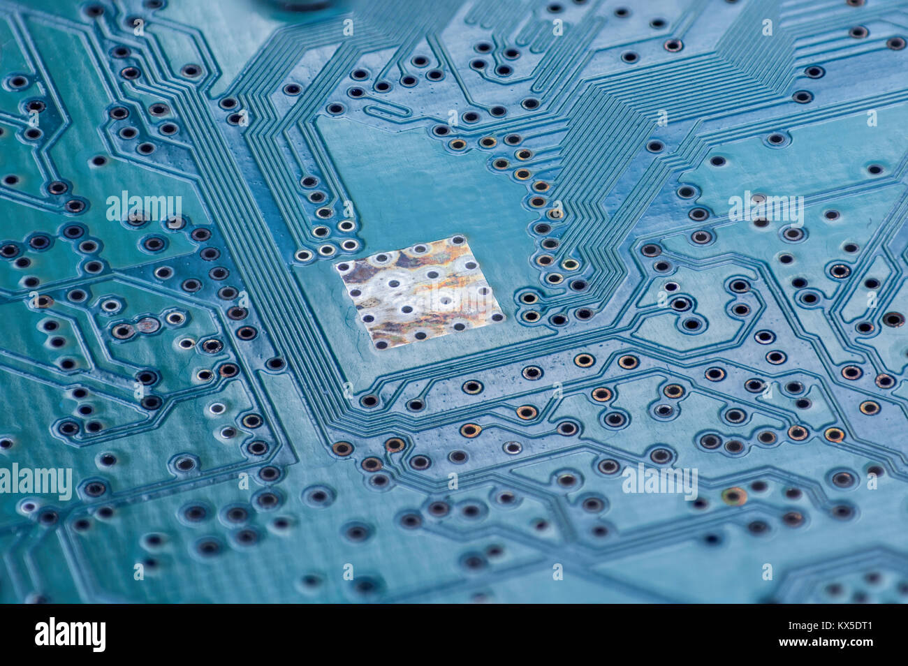 extreme close up of computer part with microcircuits in blue color ...