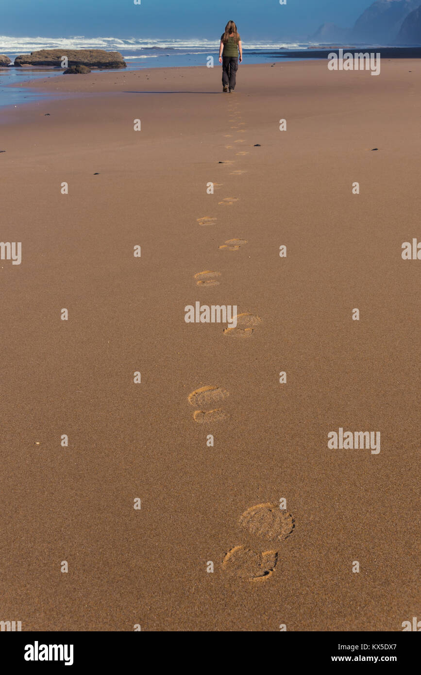 Traces in the sand walking on the beach Stock Photo - Alamy
