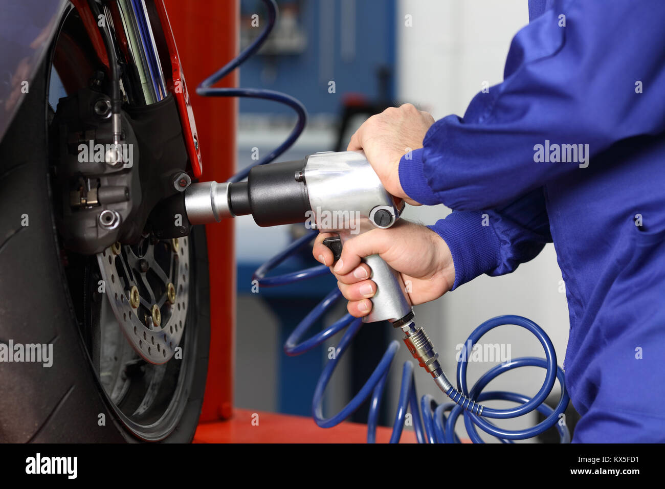 Mechanic working motorcycle workshop High Resolution Stock Photography ...