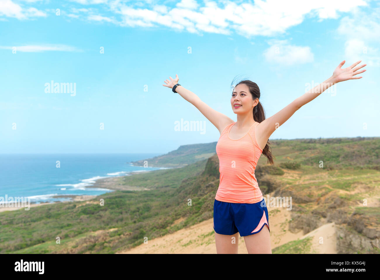 happy pretty woman runner going to running finished training standing ...