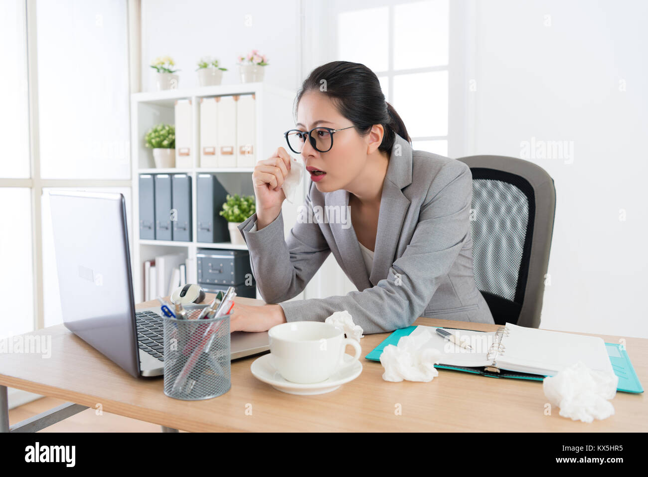 pretty young business woman using mobile laptop working in office and ...