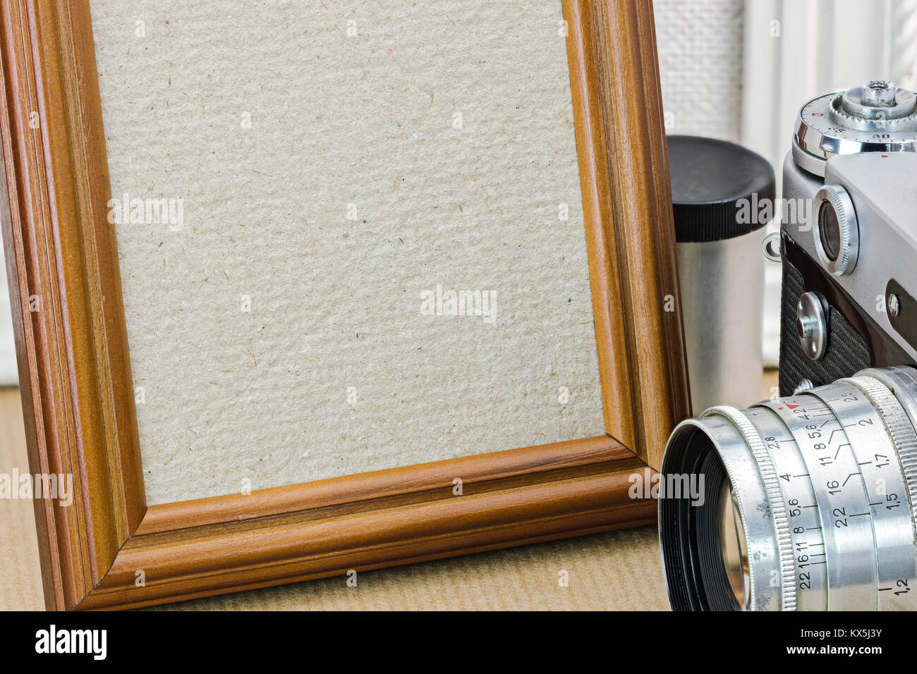 detailed view of empty wooden photo frame and old vintage camera Stock ...