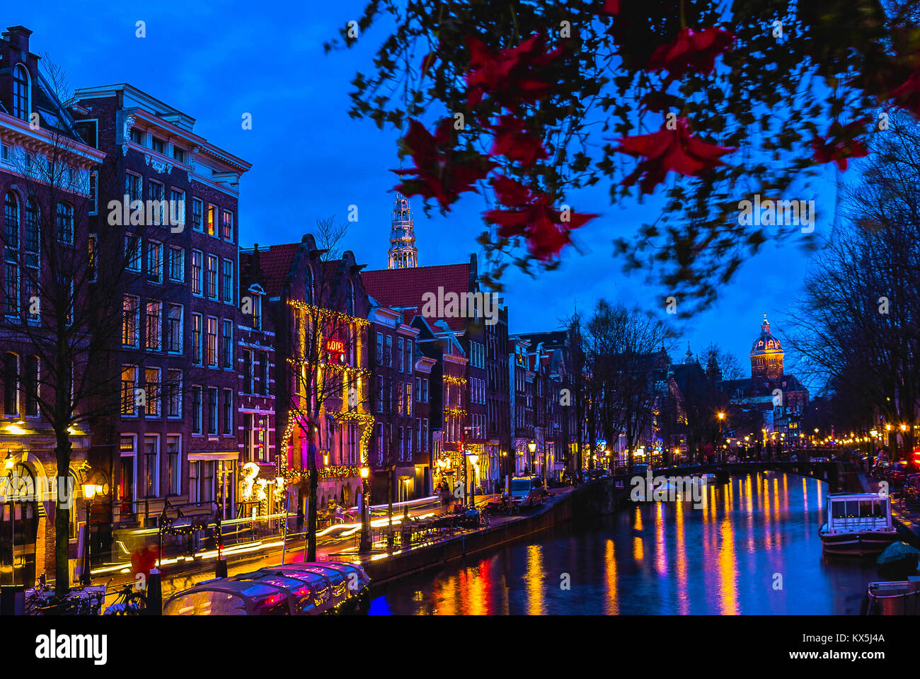 Night illumination of Amsterdam canal and bridge with typical dutch ...