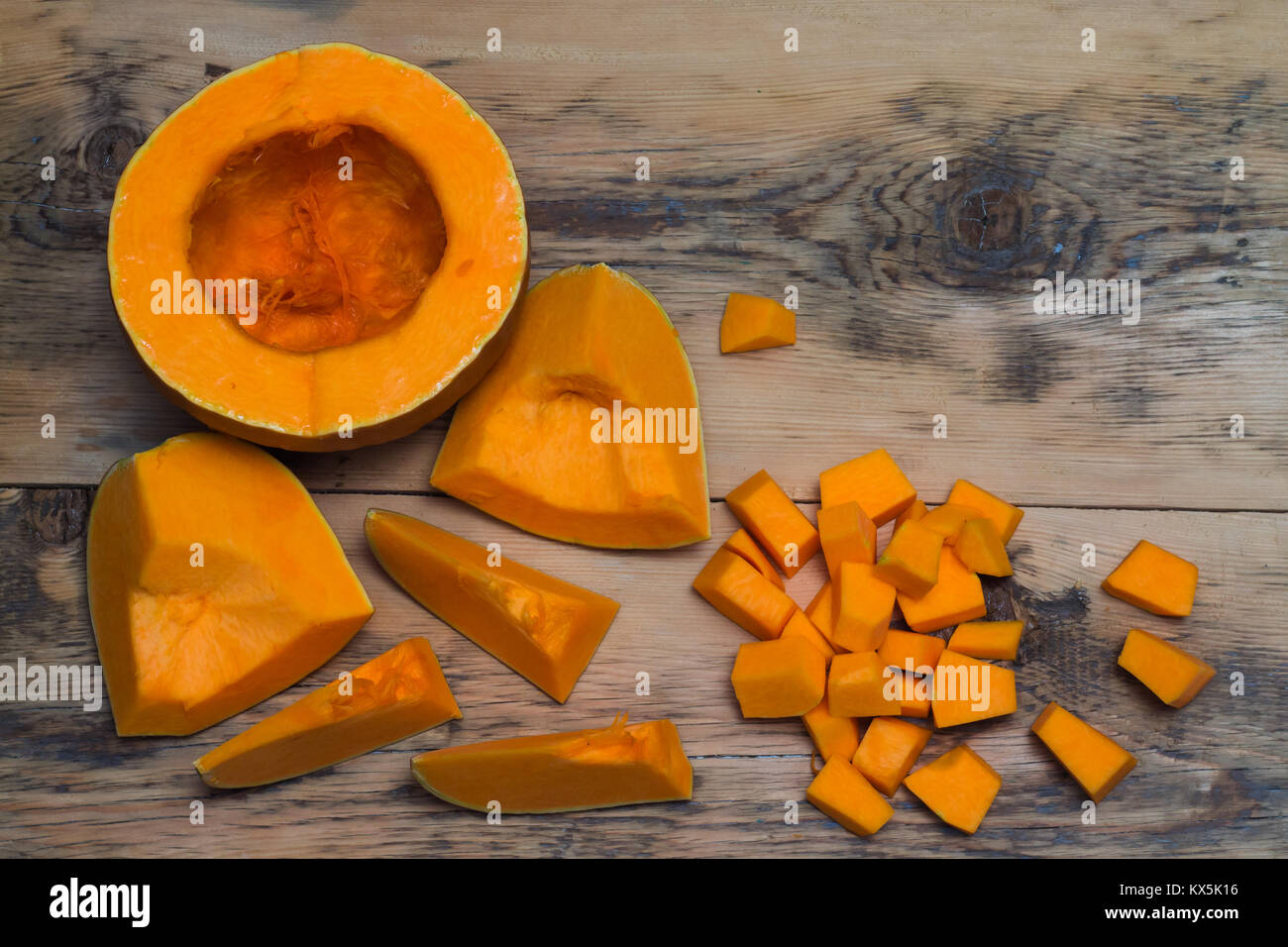 Cut into large and small pieces of pumpkin Stock Photo - Alamy