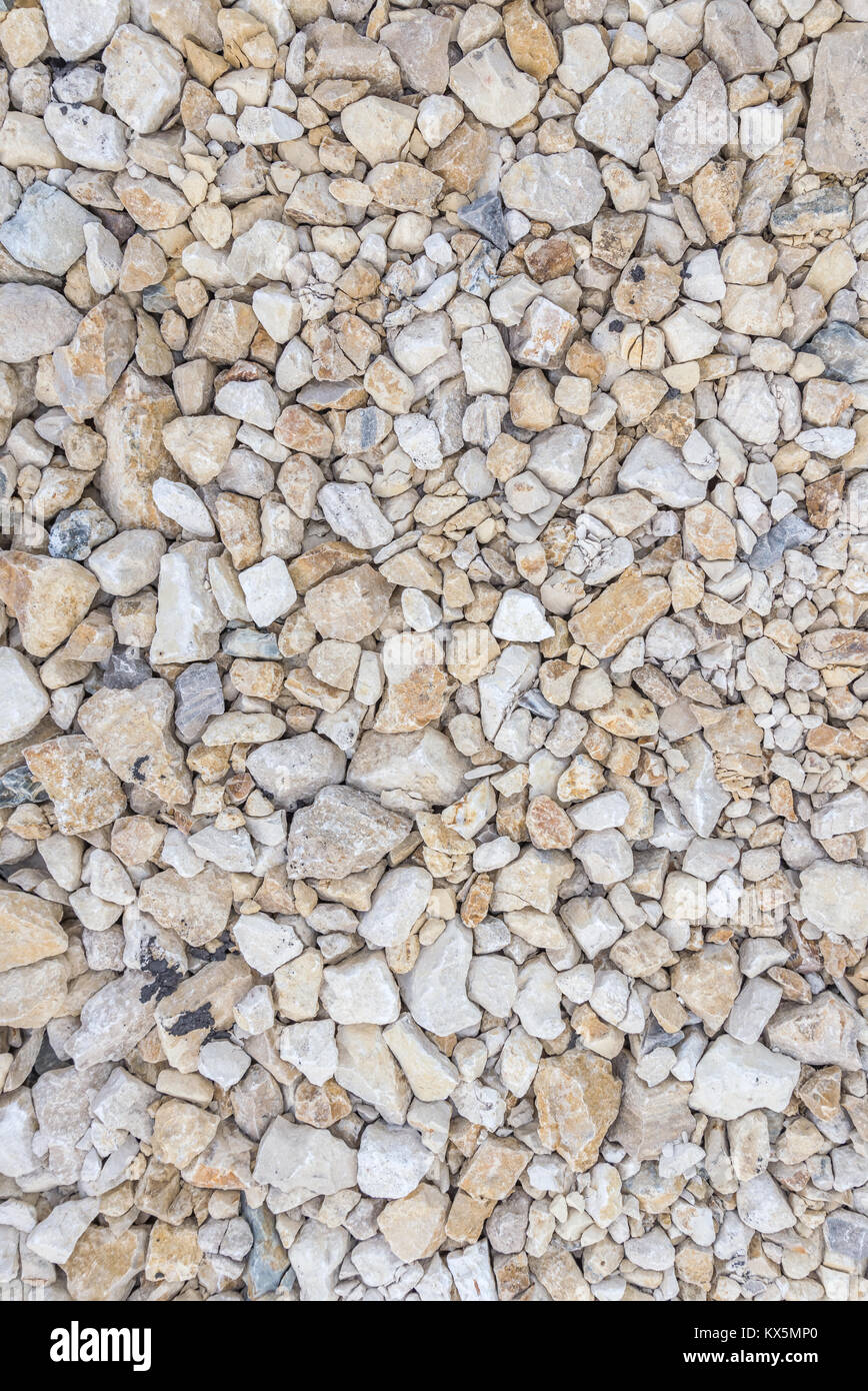 Variety of river pebbles wall. Texture with A lot of small round stones ...