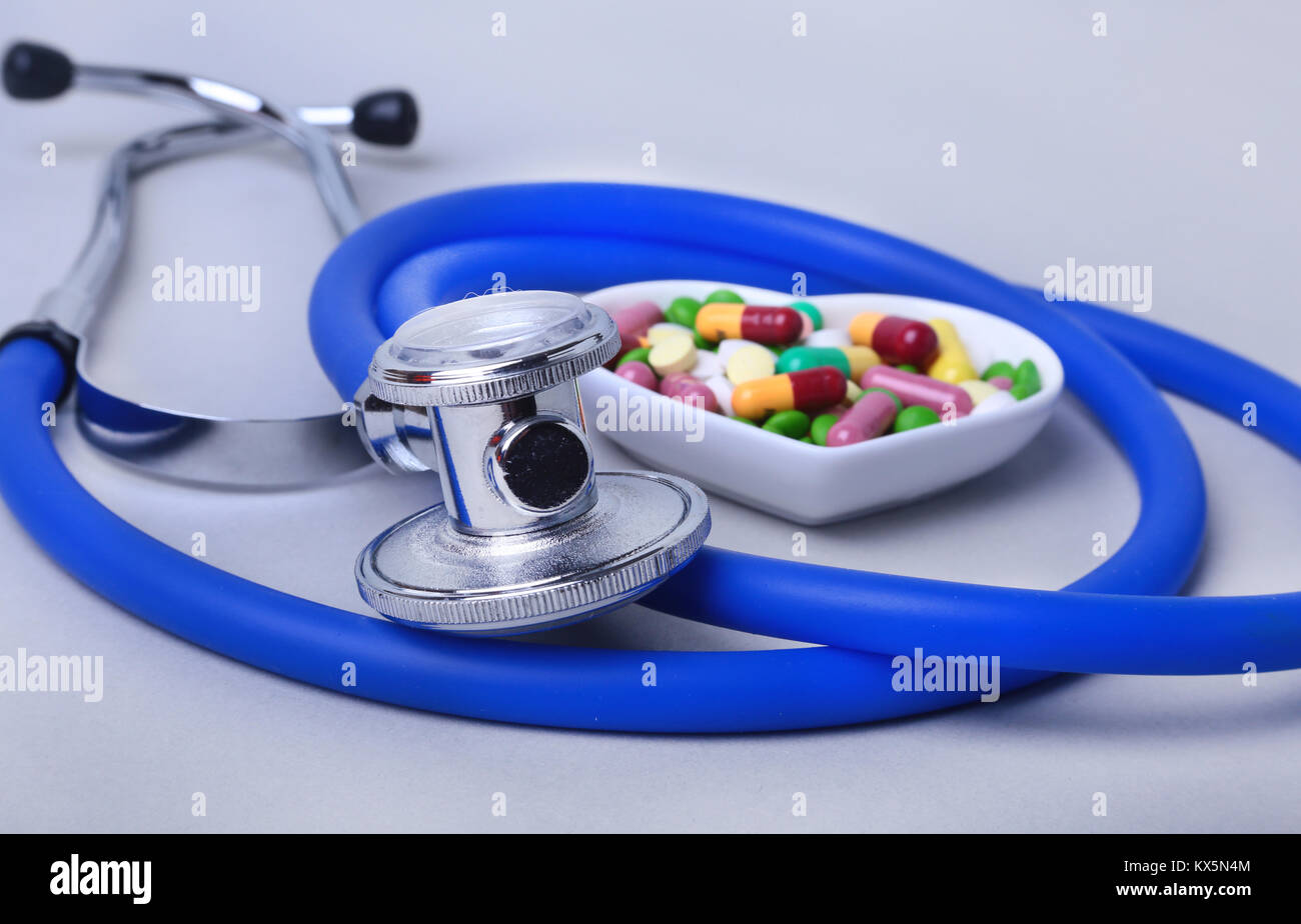 Stethoscope, RX prescription and colorful assortment pills and capsules ...