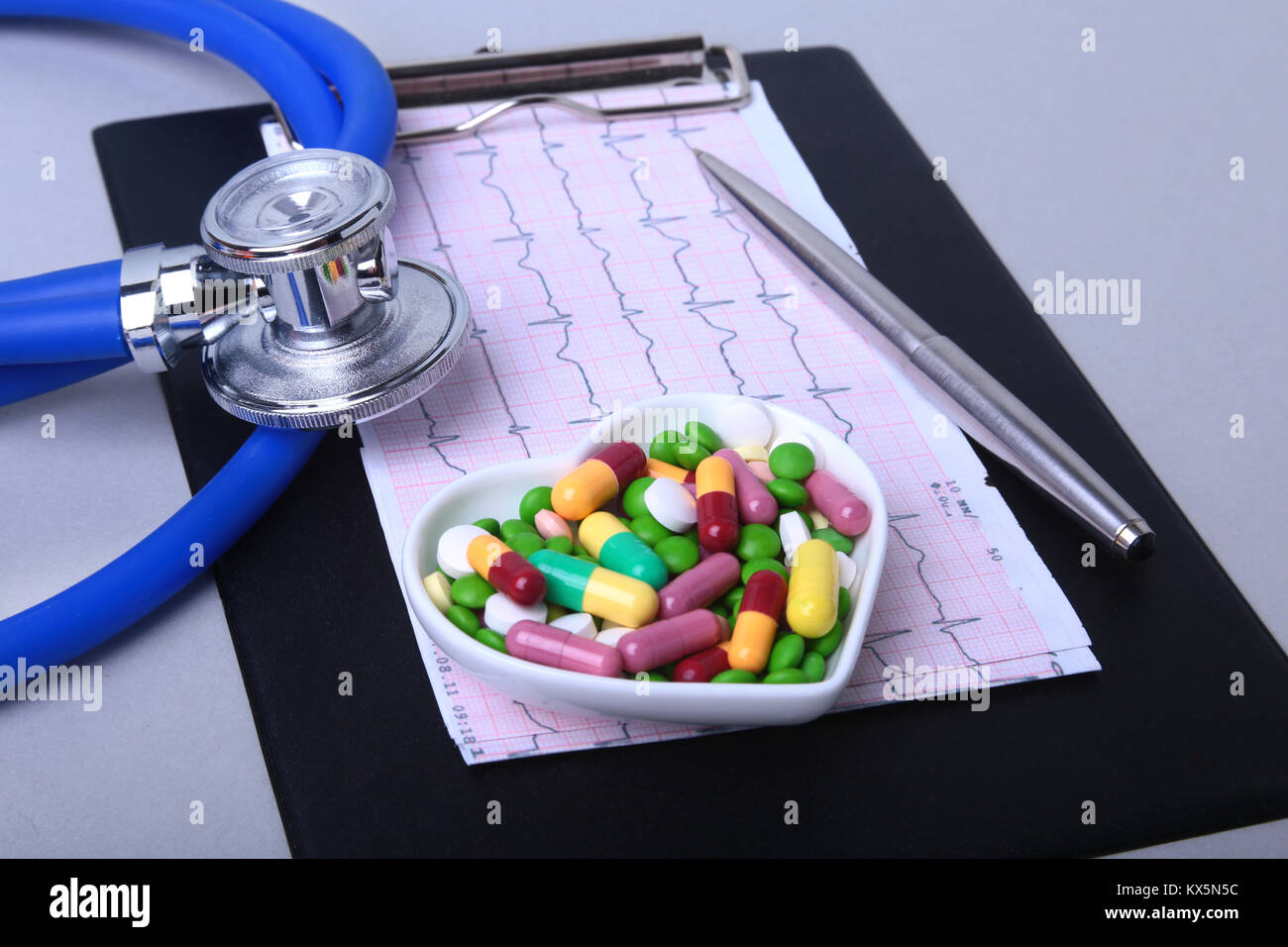 Stethoscope, RX prescription and colorful assortment pills and capsules ...