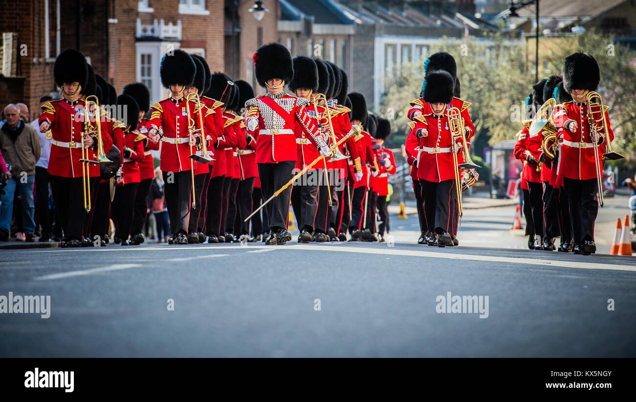 The Guards band march up from the barracks for Changing the Guard at ...
