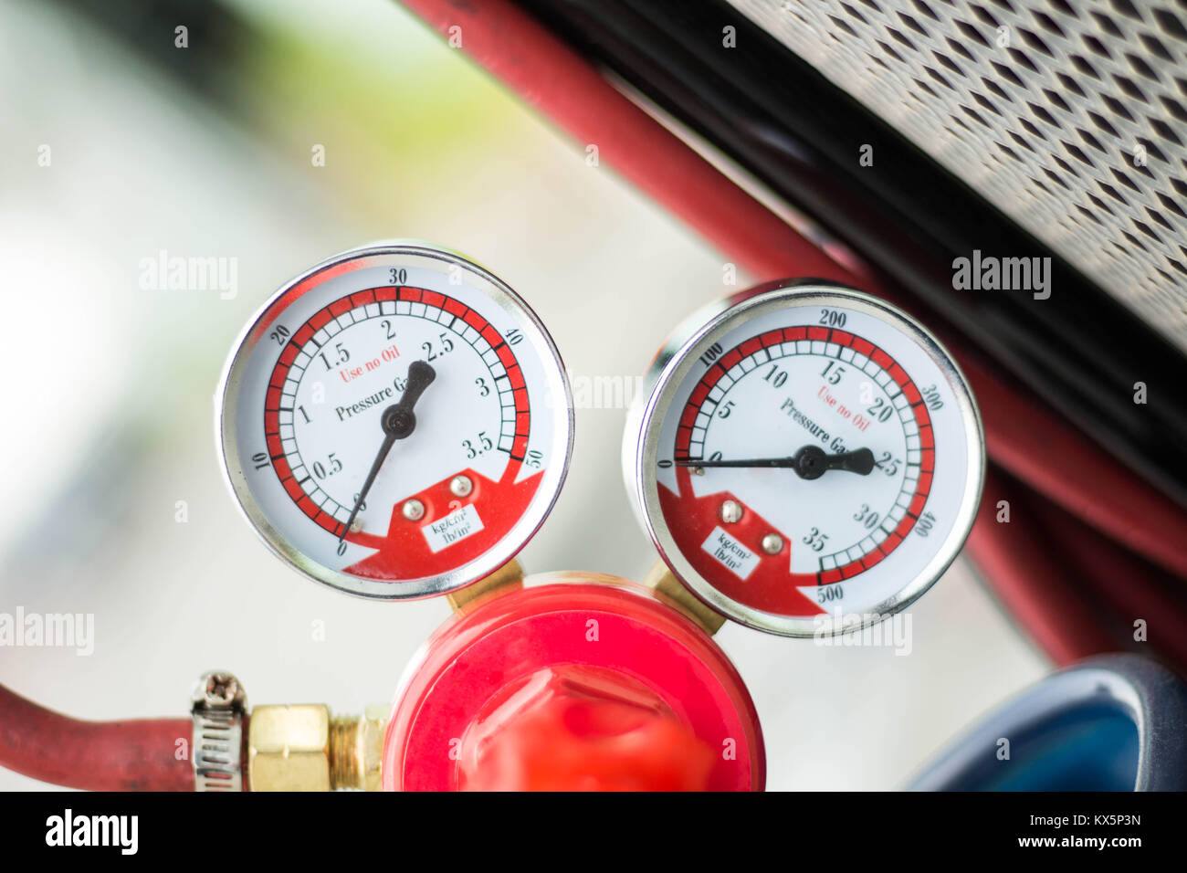 The pressure gage and valve on lpg tank Stock Photo - Alamy