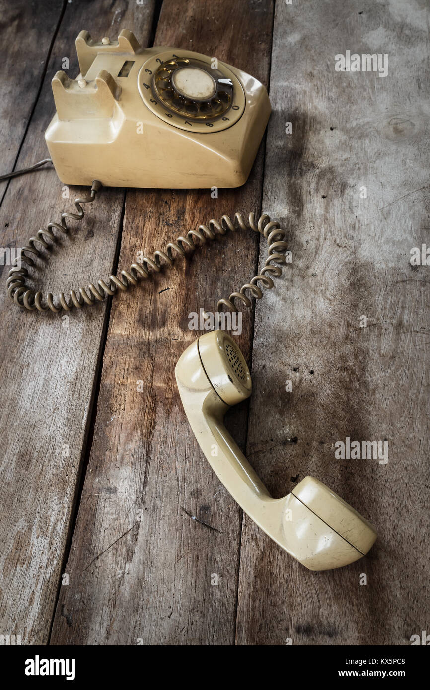 Vintage Telephone on an Old Wood Table Stock Photo - Alamy