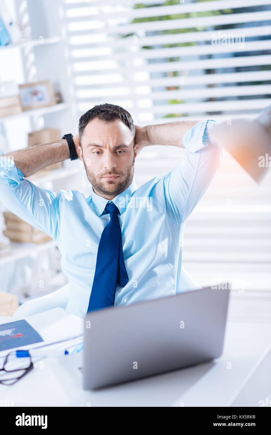 Tired young specialist feeling incapable to solve the necessary task ...