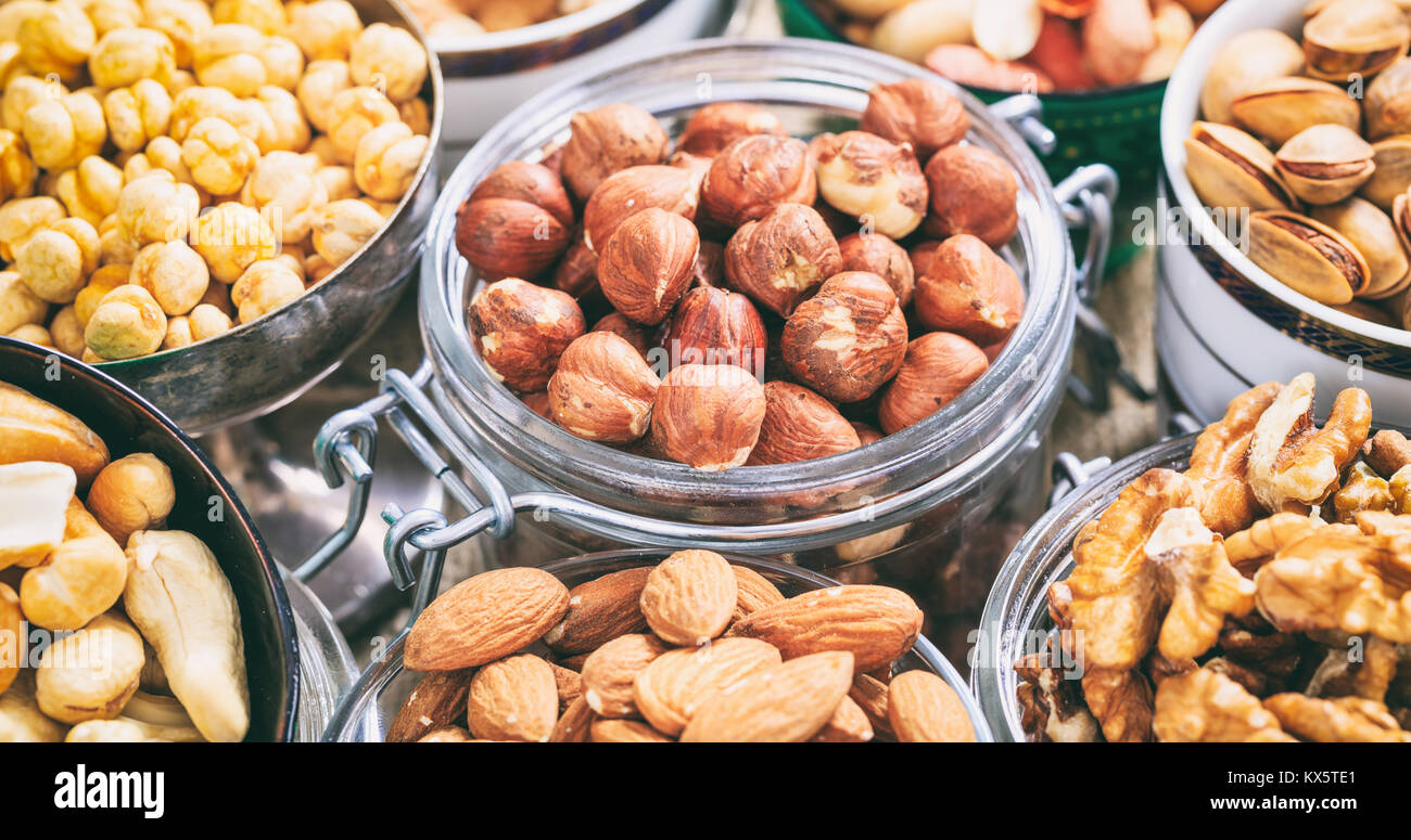 Various nuts in bowls on a table Stock Photo - Alamy