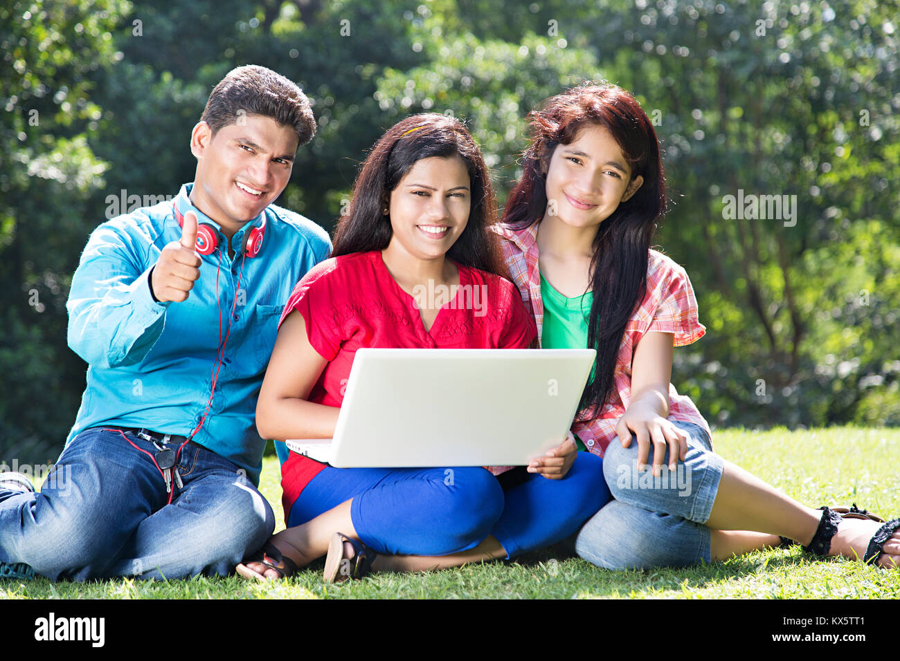 Three students studying on grass hi-res stock photography and images ...