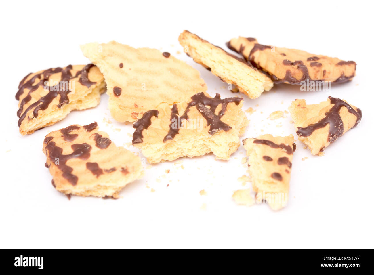 Crumbled cookie on white background Stock Photo - Alamy