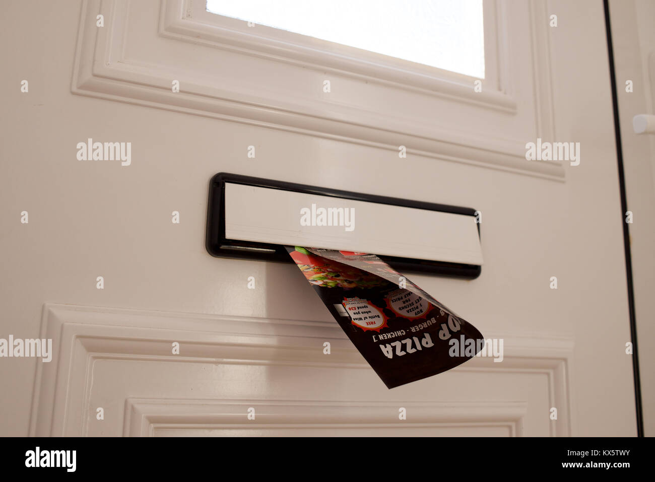 Fast food leaflet through a letterbox Stock Photo - Alamy
