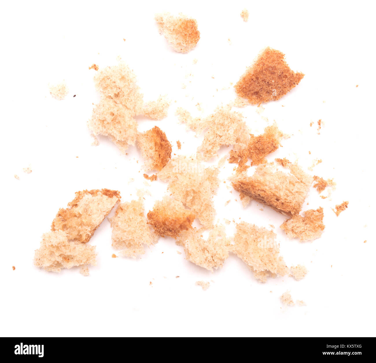 Crumbled pieces of bread on white background Stock Photo - Alamy