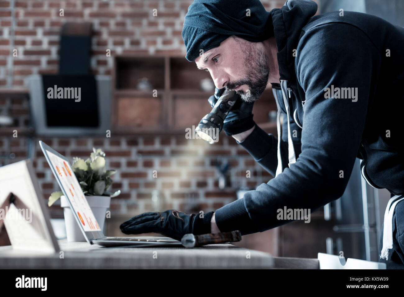 Professional hacker committing cyber attack Stock Photo - Alamy