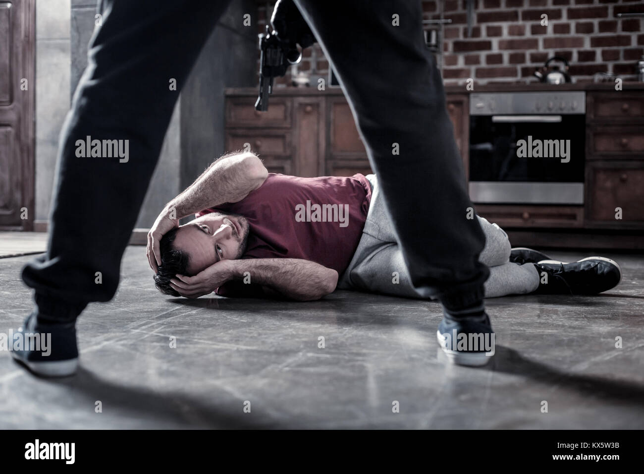 Man lying on floor gun hi-res stock photography and images - Alamy