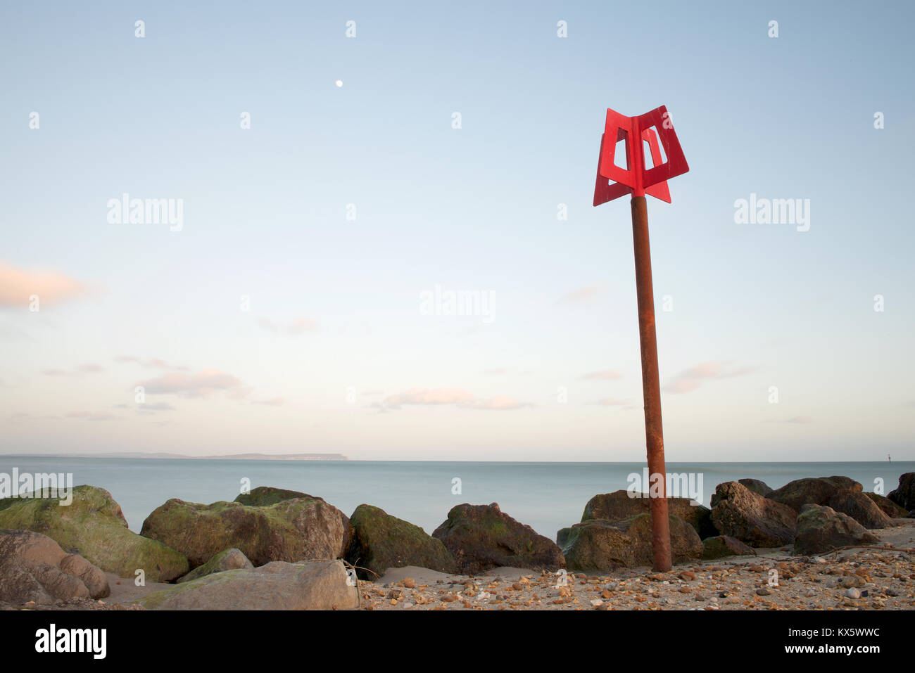 Red marker post by the beach Stock Photo - Alamy