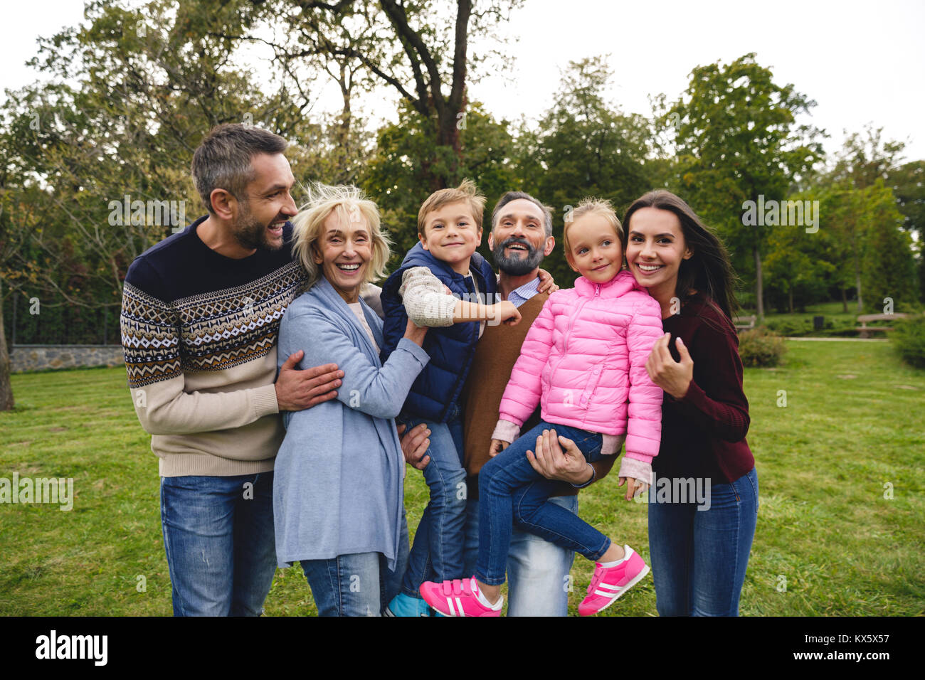 Beautiful big happy family having fun together outdoors Stock Photo - Alamy
