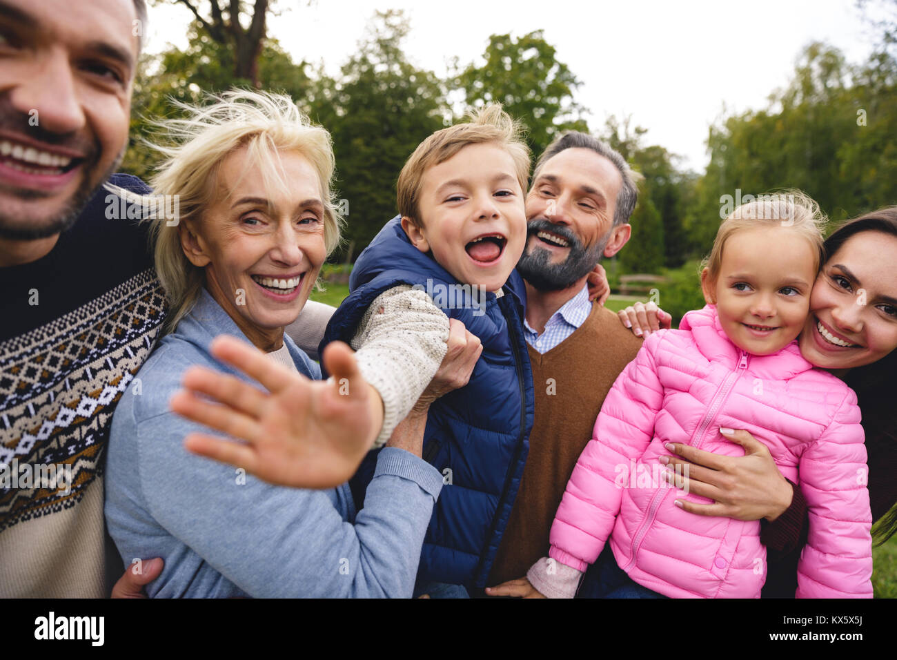 Big beautiful happy family having fun together outdoors Stock Photo - Alamy
