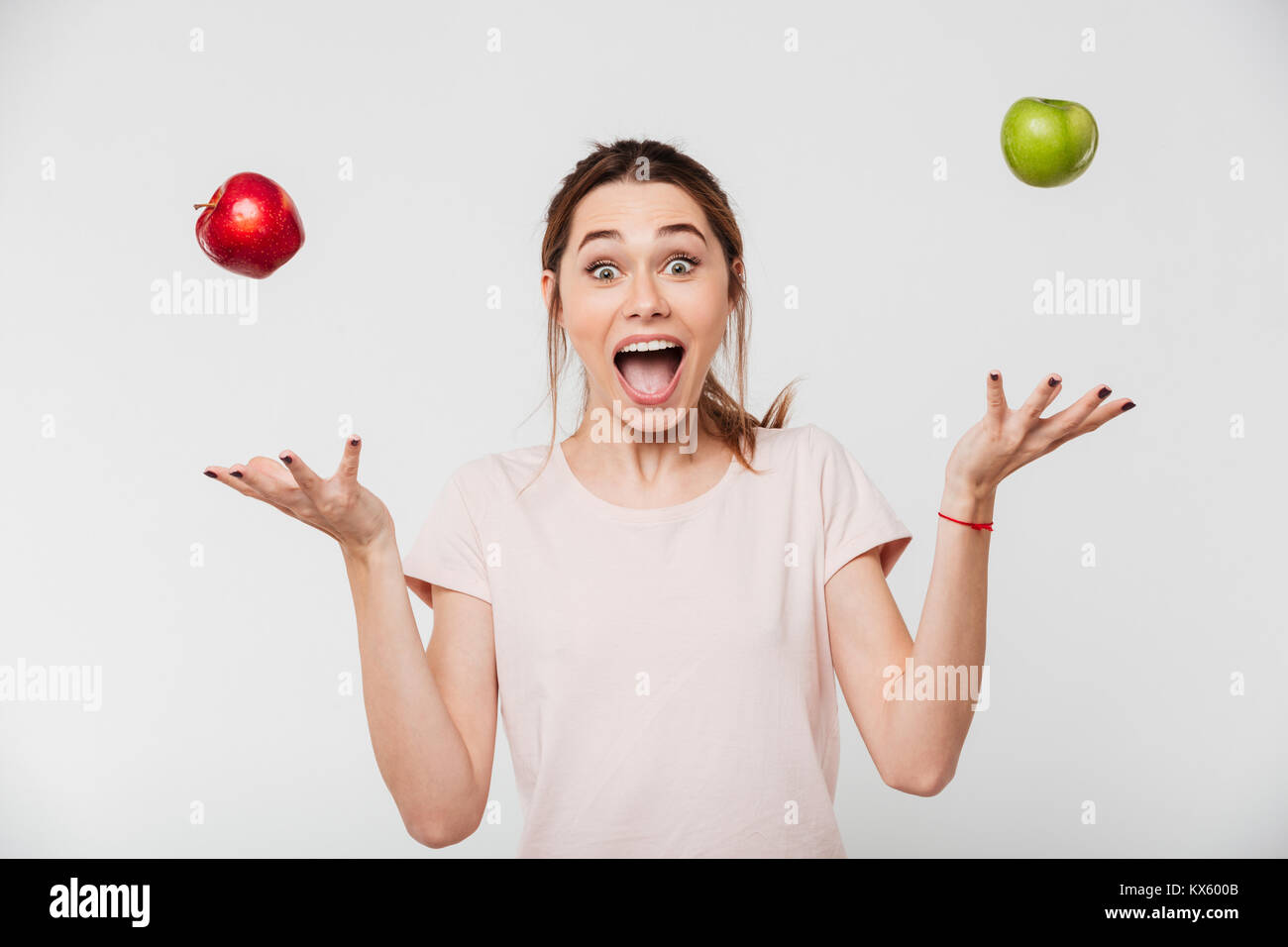 Throwing apple into air hi-res stock photography and images - Alamy