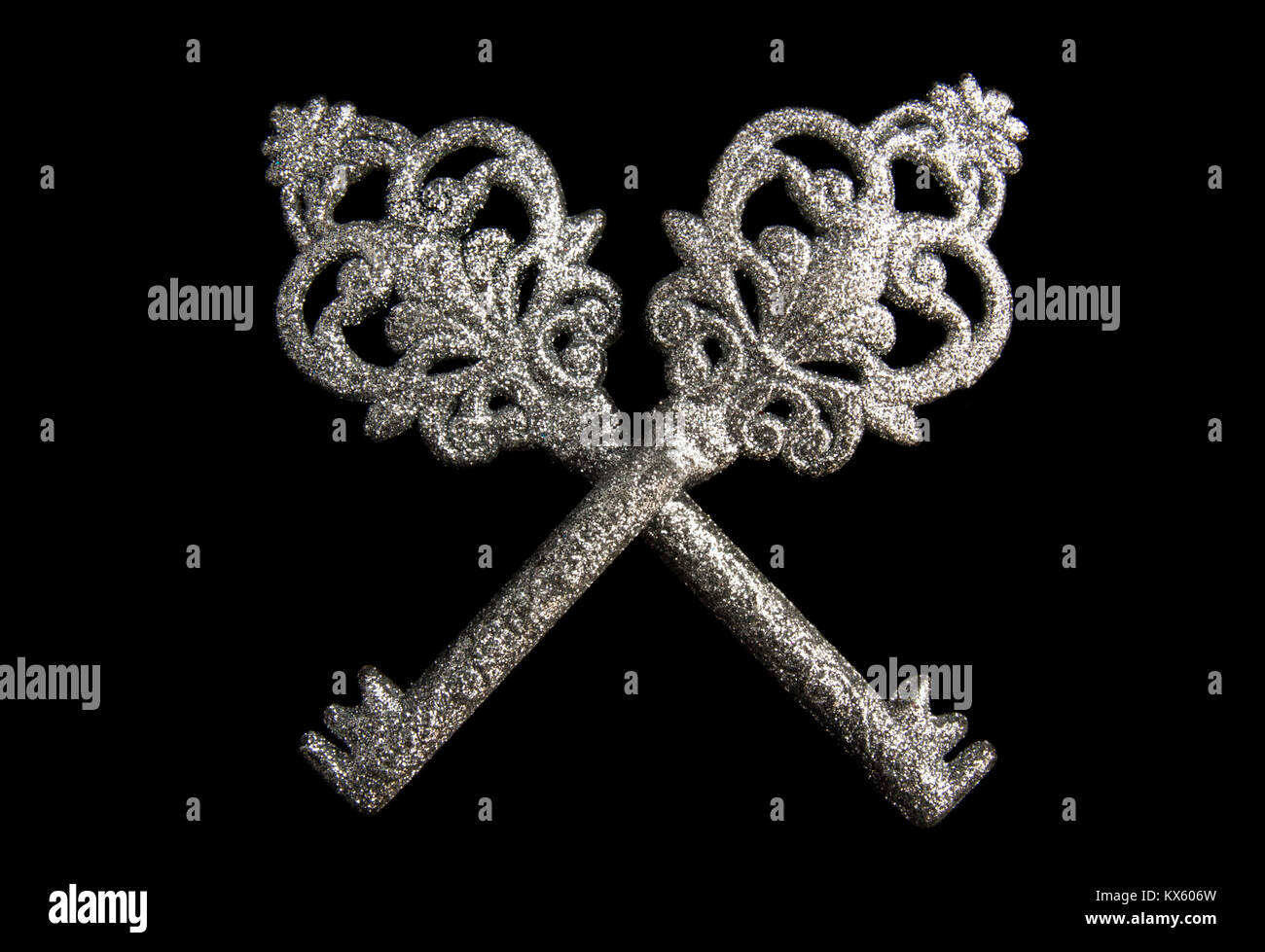 Two glitter keys isolated on a black background Stock Photo - Alamy