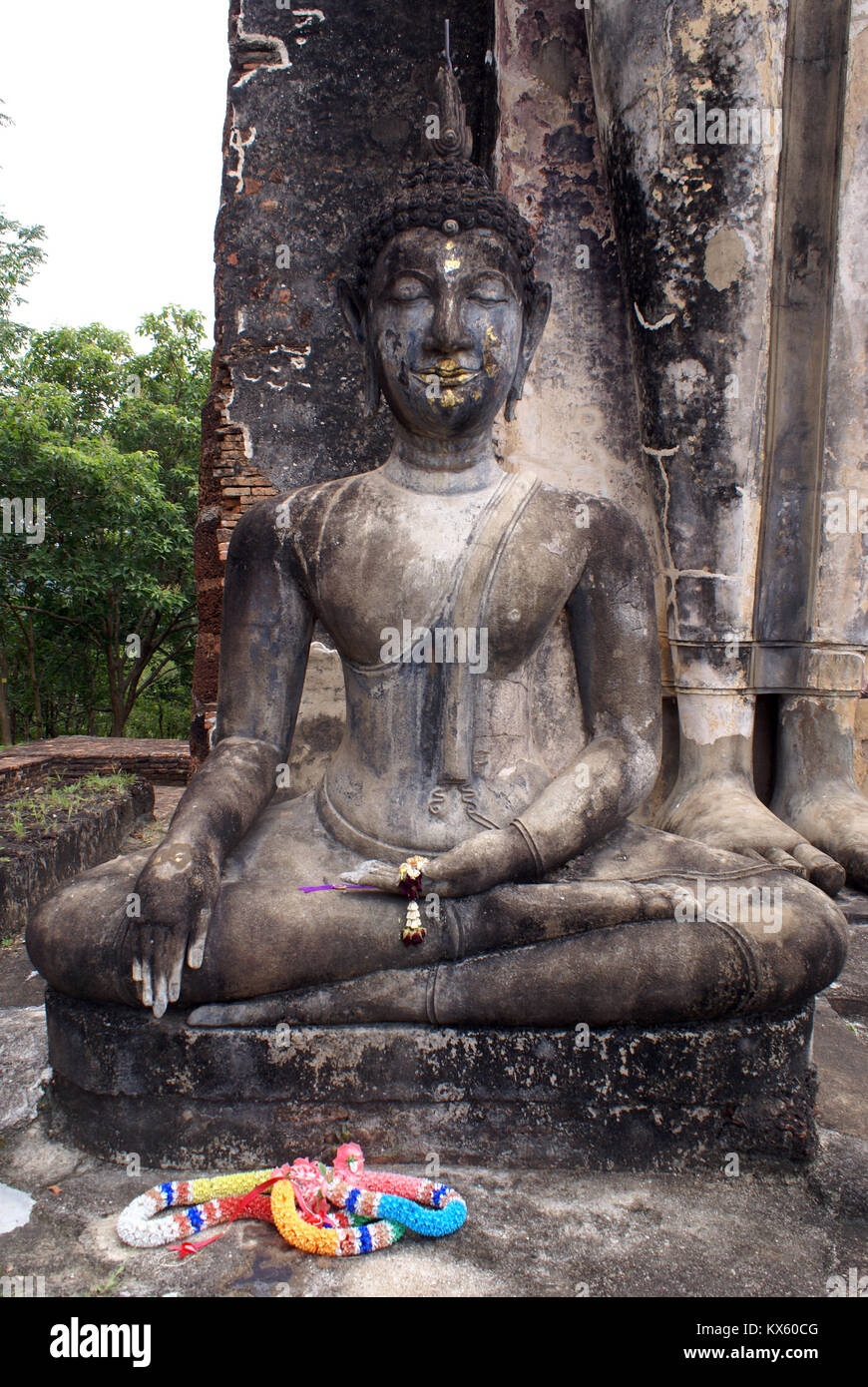 Sitting Buddha and legs in old Sukhotai, Thailand Stock Photo - Alamy