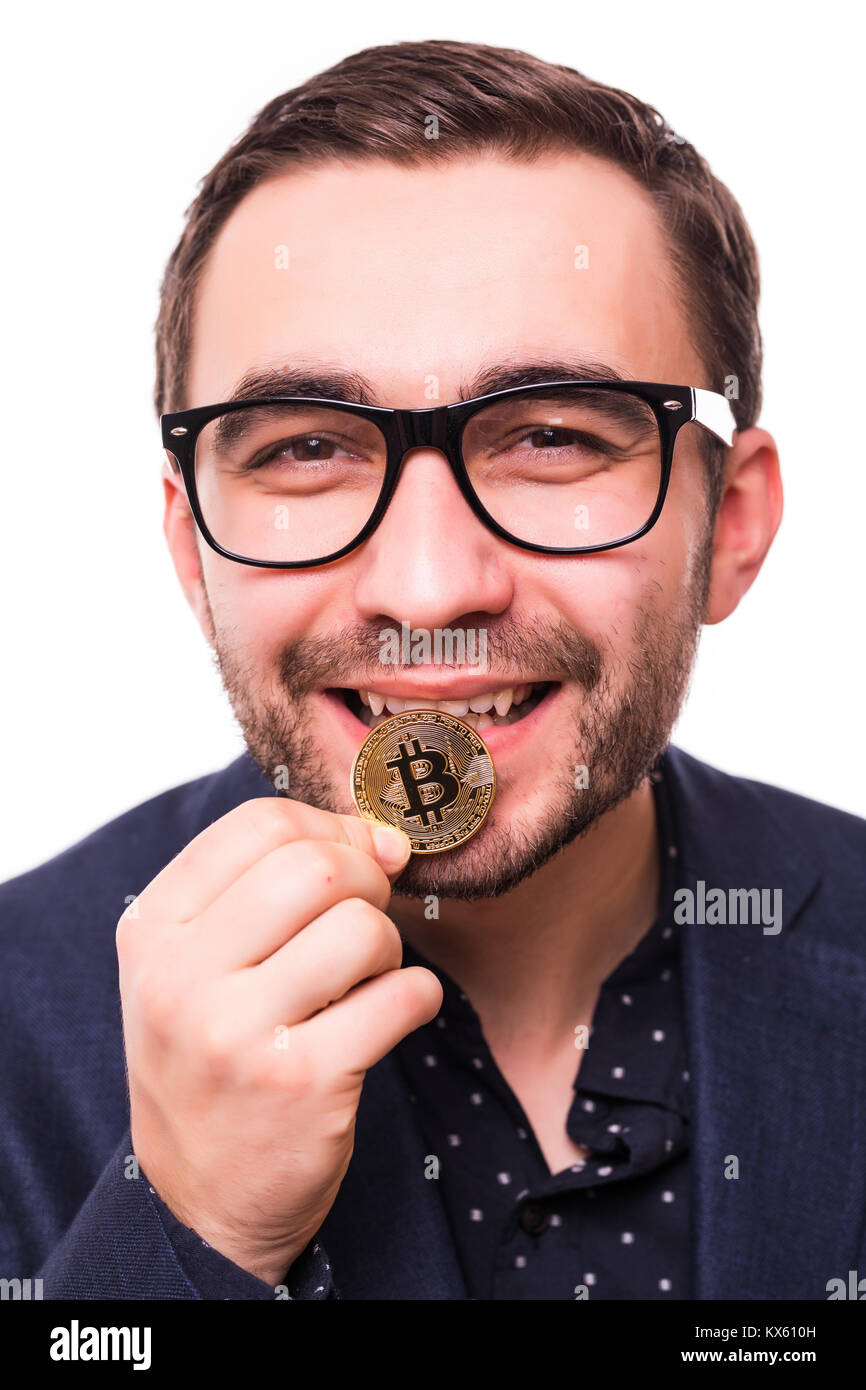 Bitcoin. Man bites a gold coin with his teeth Stock Photo - Alamy