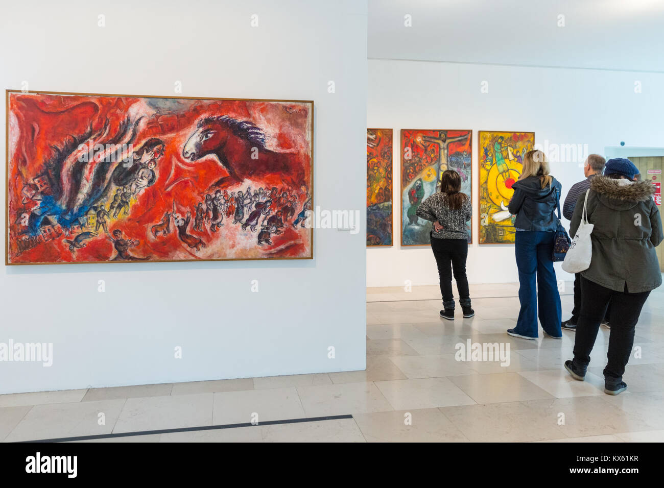 People look at Marc Chagall paintings Le cheval roux and triptych ...