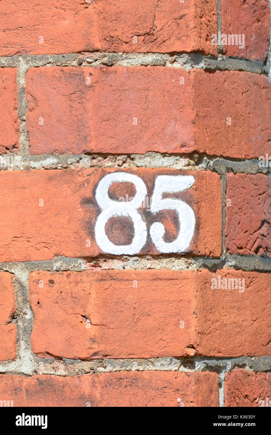 House number 85 sign painted on wall Stock Photo - Alamy