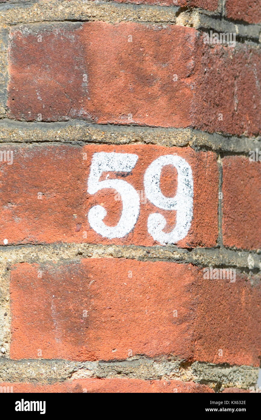 House number 59 sign painted on wall Stock Photo - Alamy