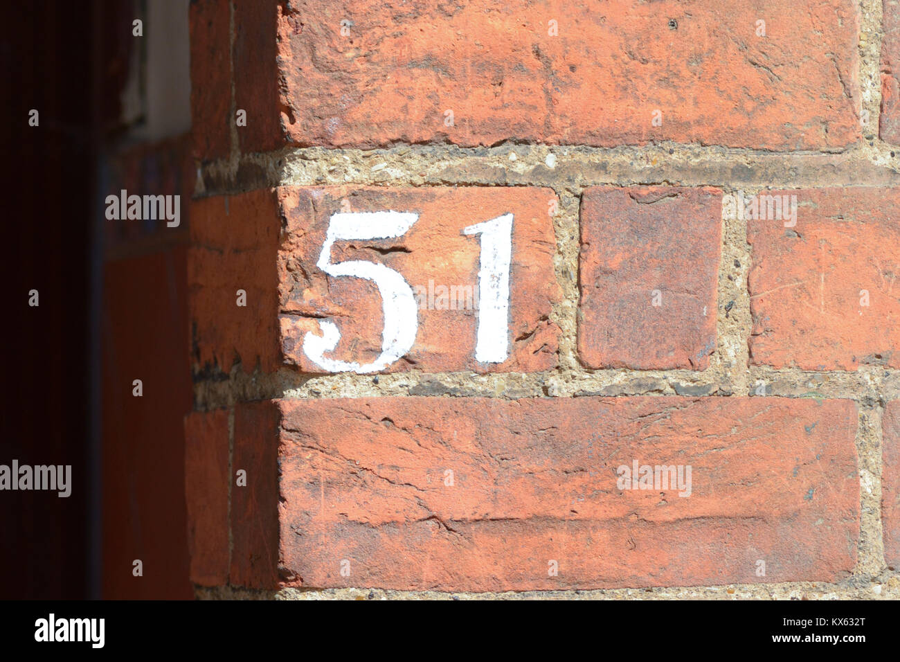 House number 51 sign painted on wall Stock Photo - Alamy