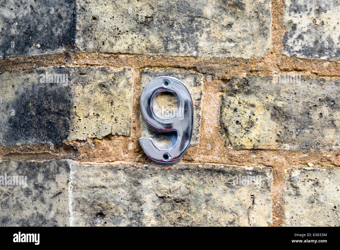 House number 9 sign on wall Stock Photo - Alamy