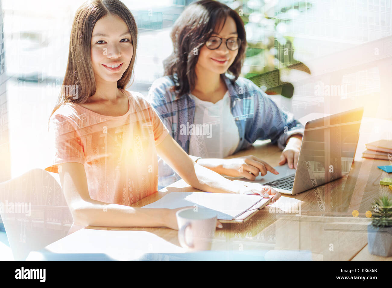 Pleasant nice woman smiling Stock Photo - Alamy