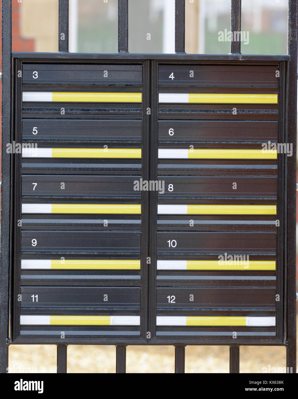set of 12 letterboxes outside entrance to apartment building Stock ...