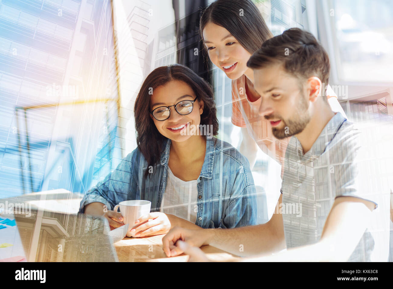 Nice smart people working in the office Stock Photo - Alamy