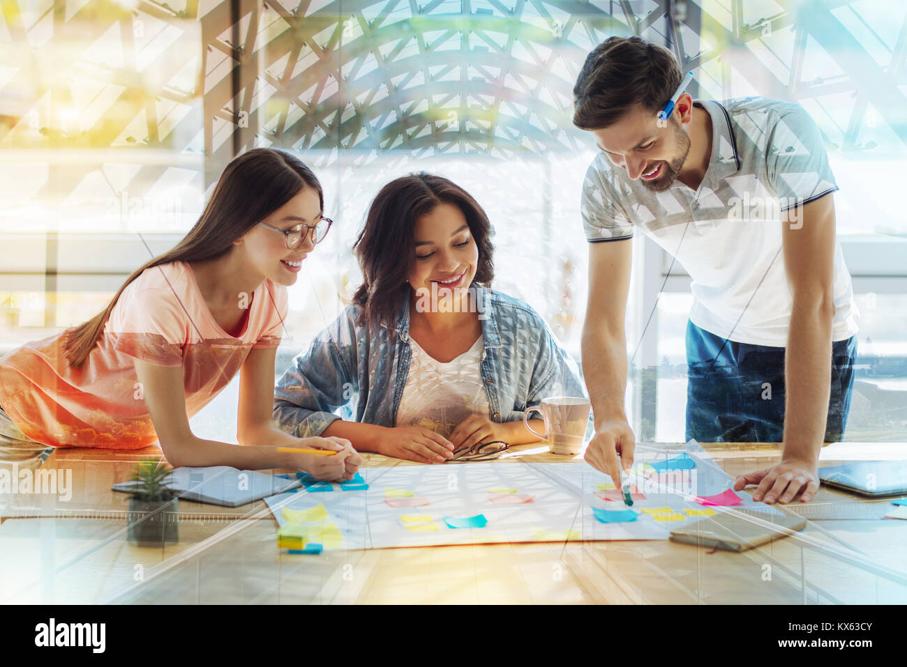 Nice joyful man explaining his ideas Stock Photo - Alamy