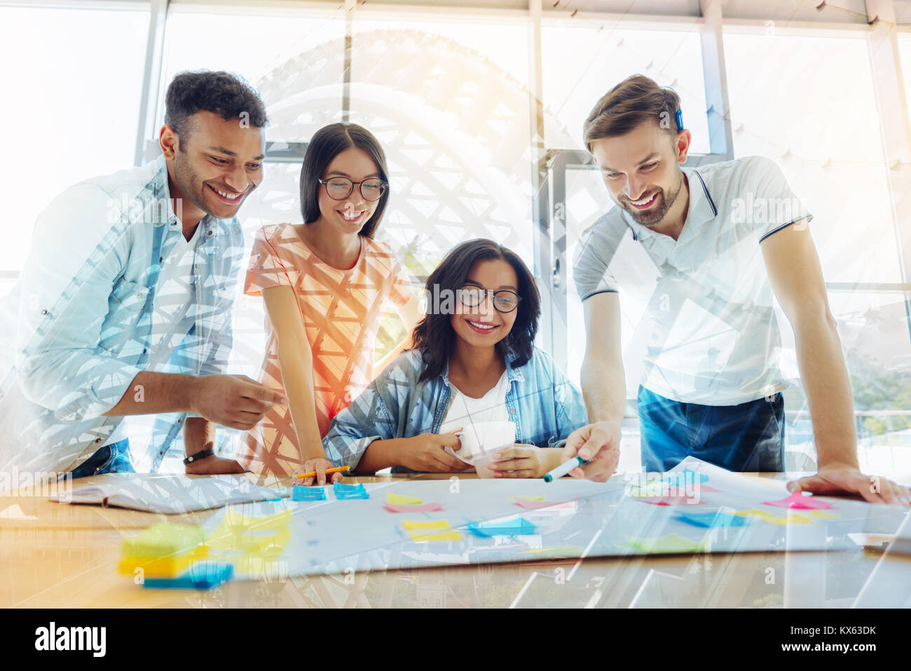 Positive creative team discussing their project Stock Photo - Alamy