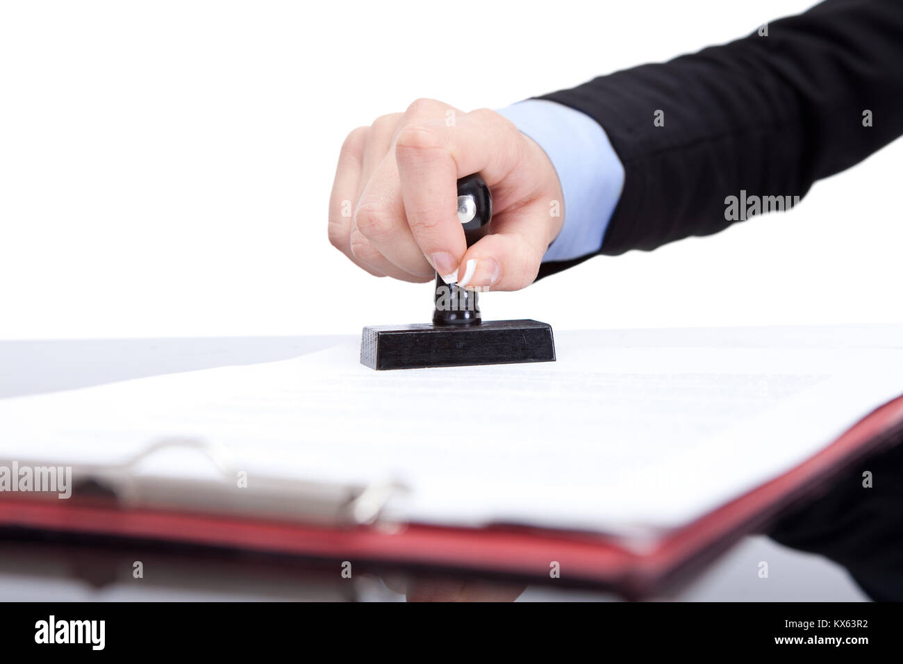 Hand with the seal, stamping the contract, close up Stock Photo - Alamy