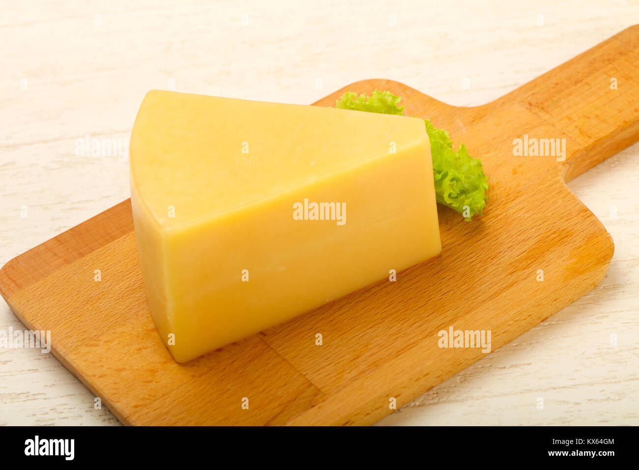 Parmesan cheese triangle Stock Photo - Alamy
